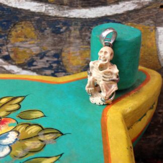 Geoclassics | Fossil Ivory Sitting Skeleton Pendant