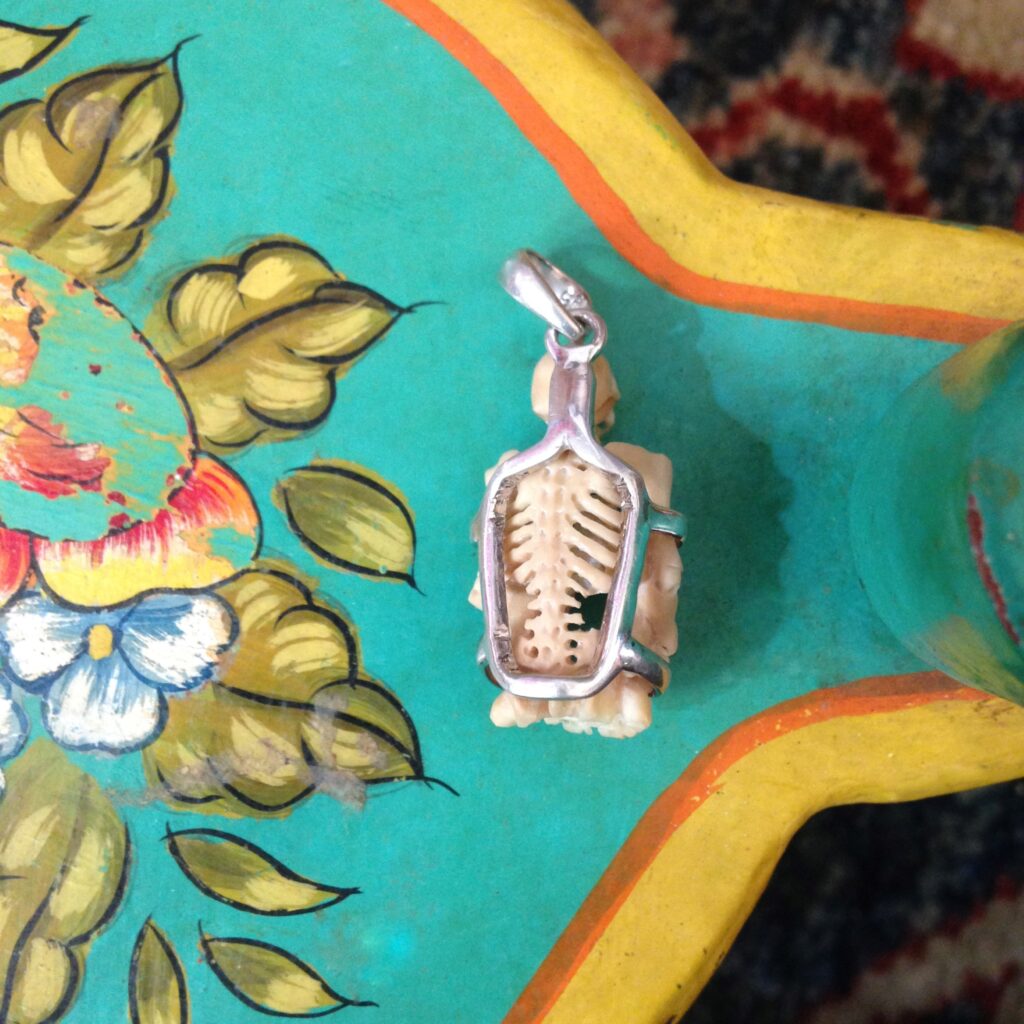 Geoclassics | Fossil Ivory Sitting Skeleton Pendant